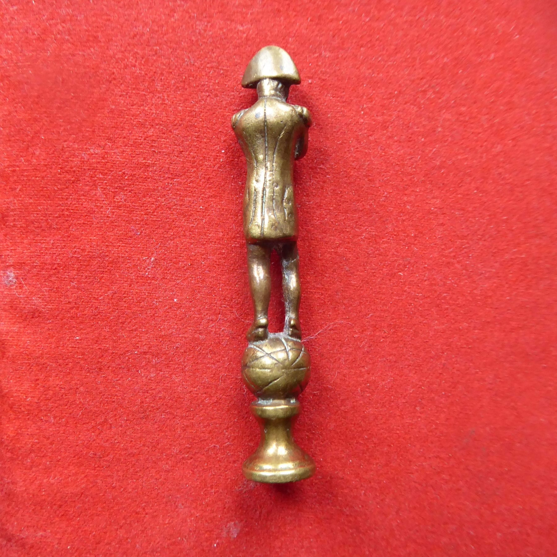 Napoleon. A 19th century brass pipe tamper. – Bates and Hindmarch